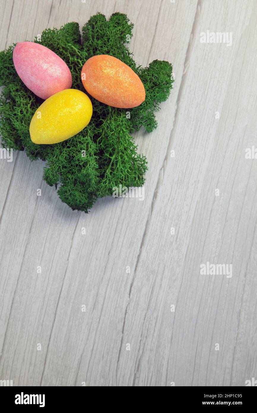 Happy Easter holliday concept, colorful easter eggs with green moss on ...