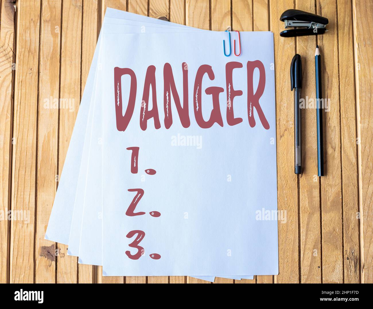 Hand writing sign Danger, Concept meaning the possibility of something ...
