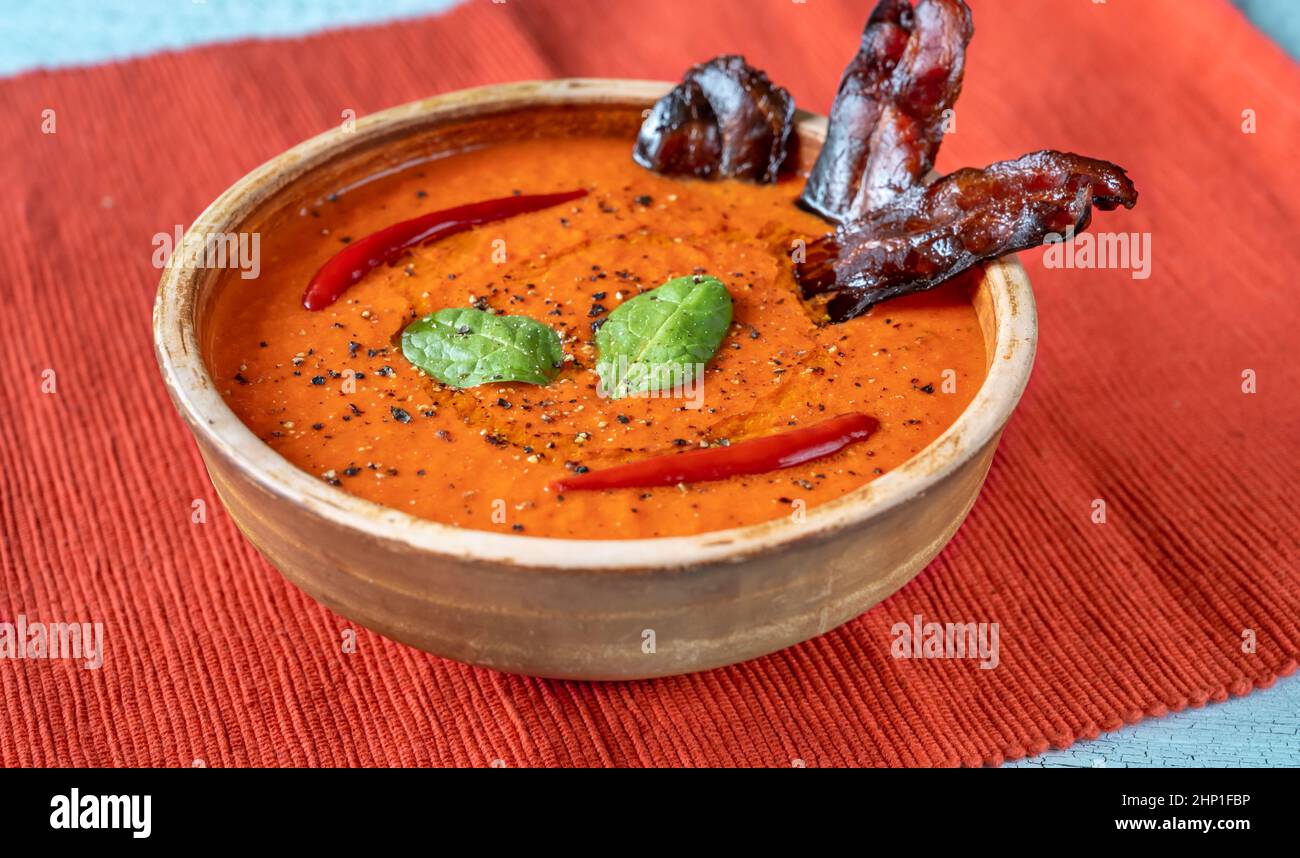 Bowl of creamy grilled red pepper soup Stock Photo - Alamy
