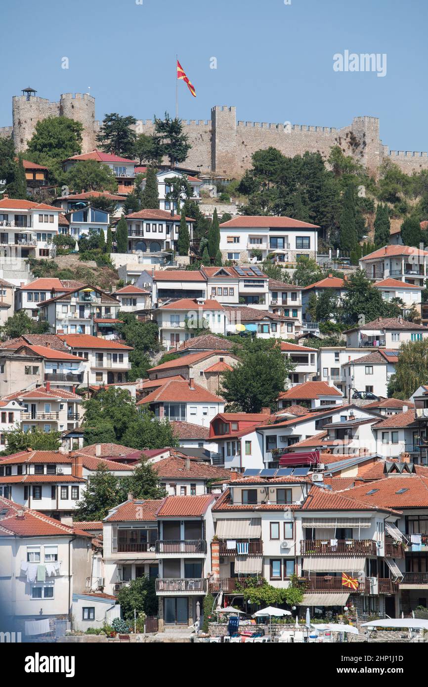 Many small houses on the coast of the Lake Ohrid with docks and moored ...