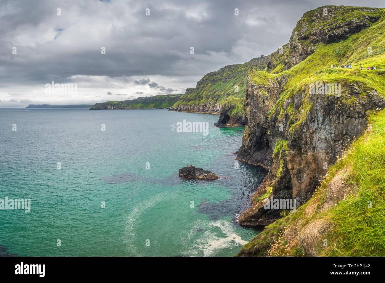 Coastline with tall limestone cliffs, Rathlin Island and turquoise ...