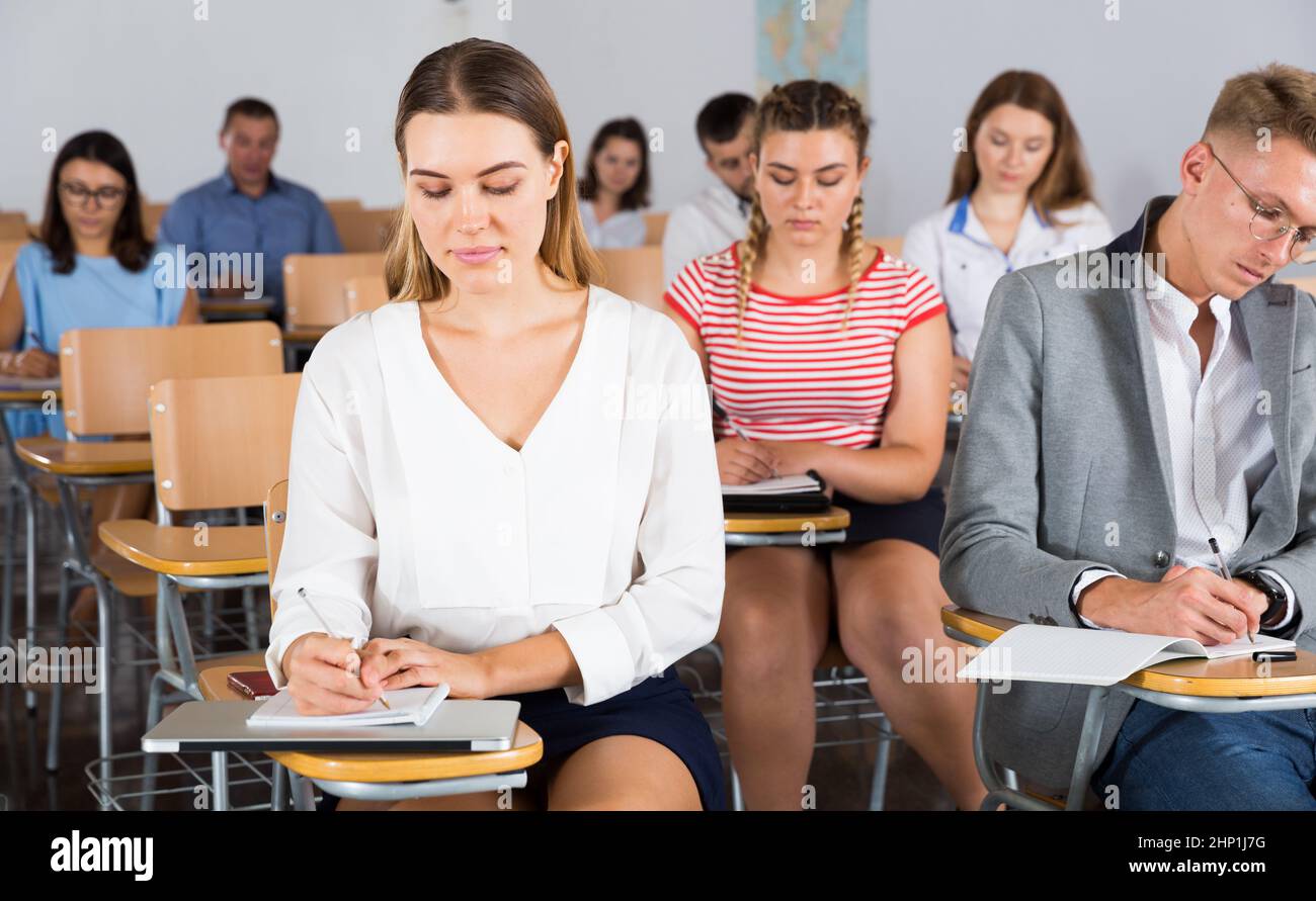 Group of people in lecture hall Stock Photo - Alamy