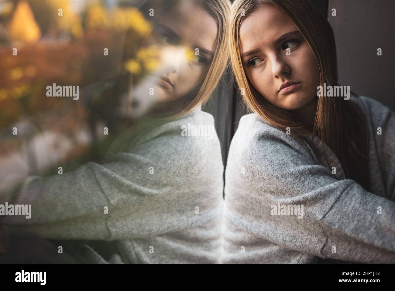 Woman feeling scared house hi-res stock photography and images - Alamy