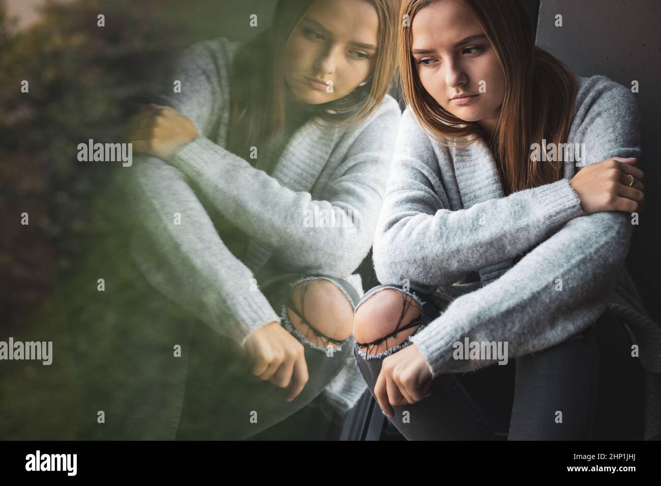 Girl scared alone window hi-res stock photography and images - Alamy