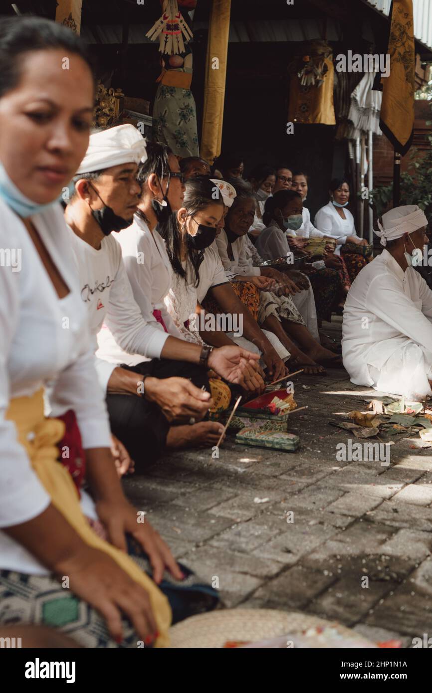 Balinese people in traditional sarong during Hindu ceremony Stock Photo ...
