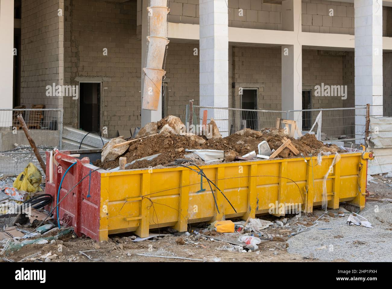 Big metal full Overloaded dumpster waste container filled with ...