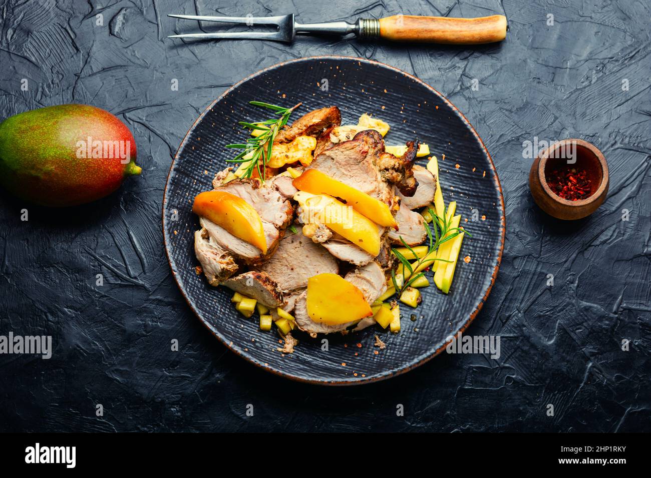 Delicious grilled meat with mango and cheese Stock Photo - Alamy