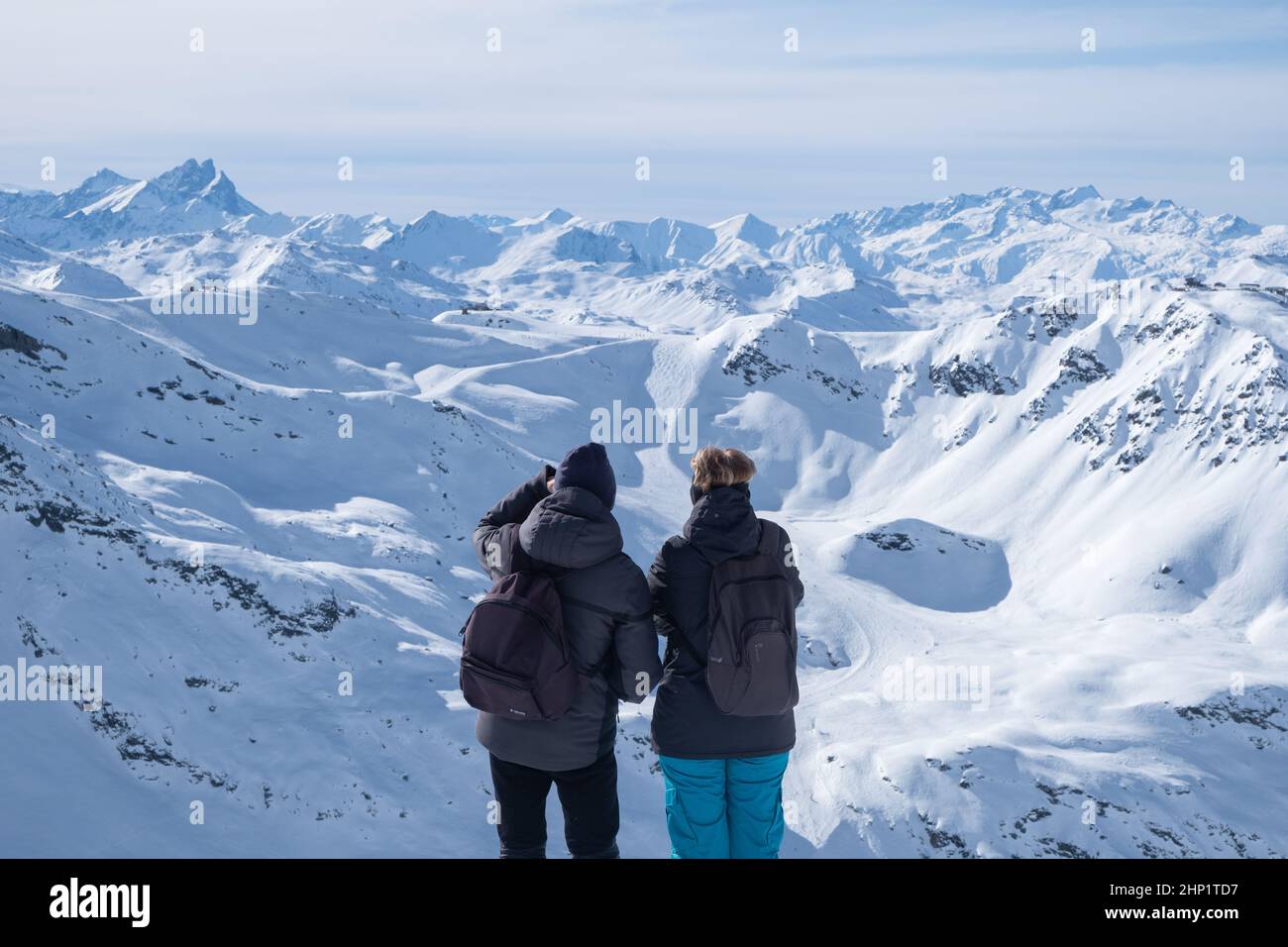 Skiers admiring the view from the top of Mt Vallon, Méribel Stock Photo ...