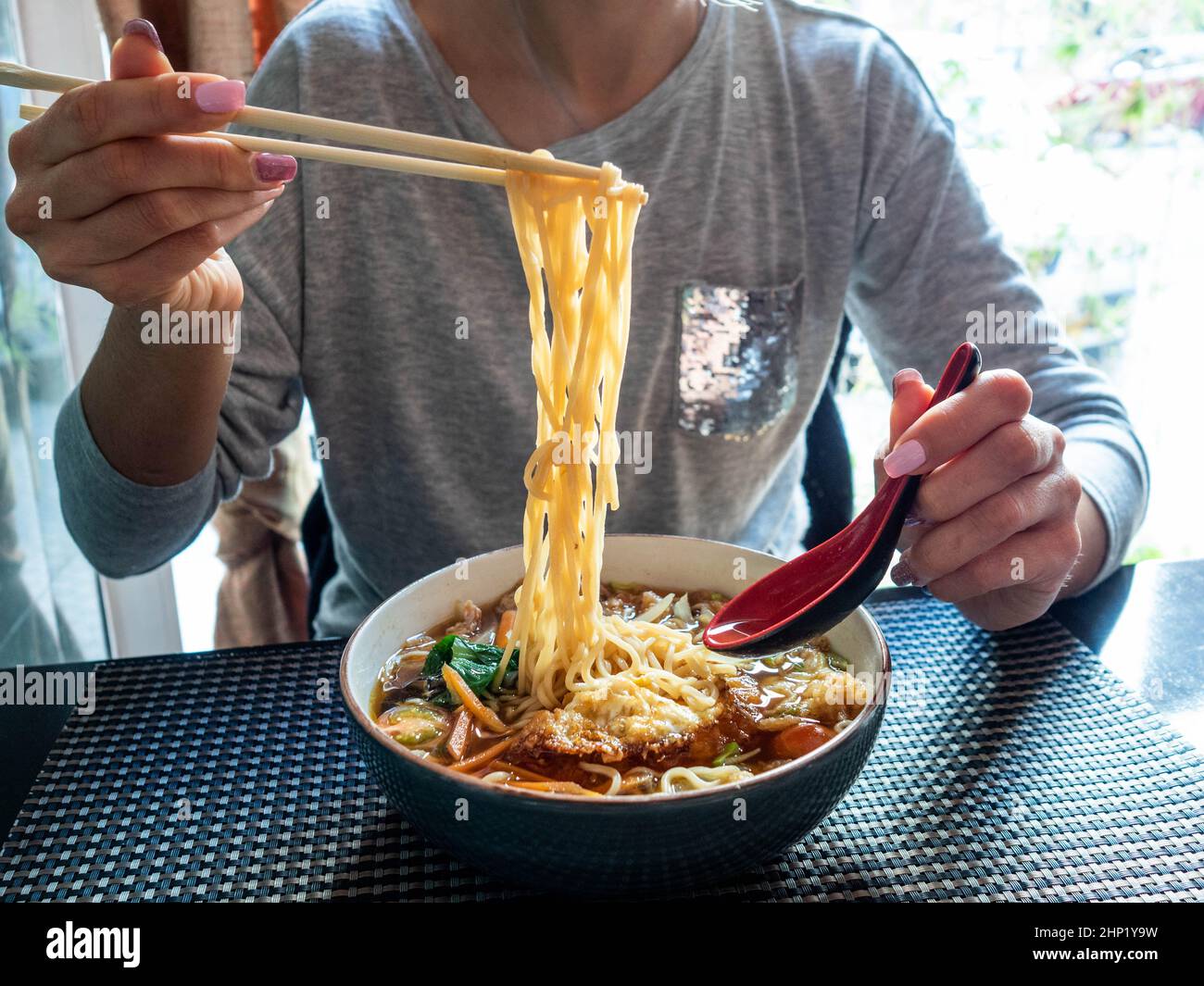 Ramen eat woman chopsticks bowl hi-res stock photography and images - Alamy