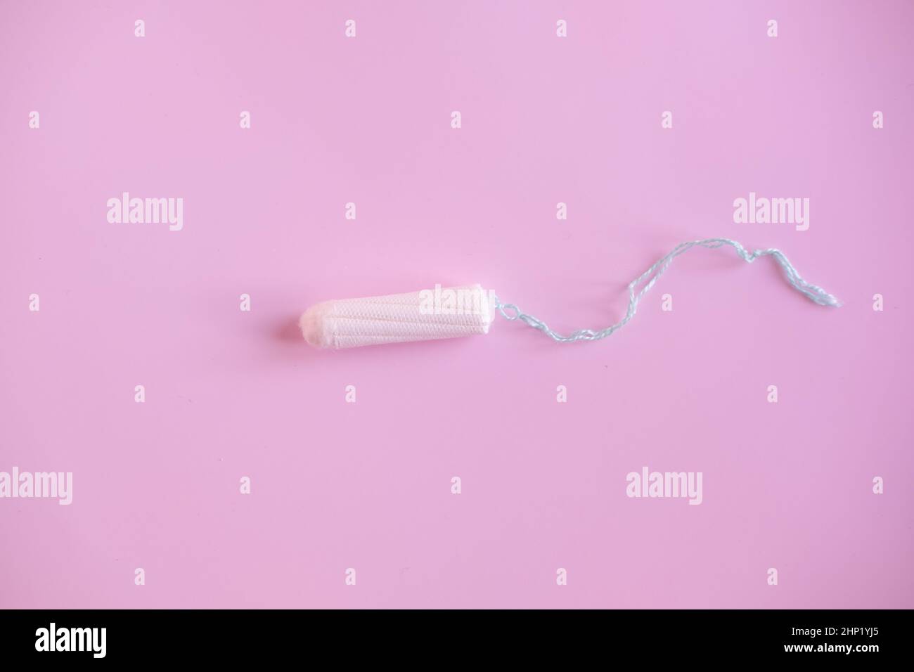female tampon on a pink background. Hygienic white tampon for women ...