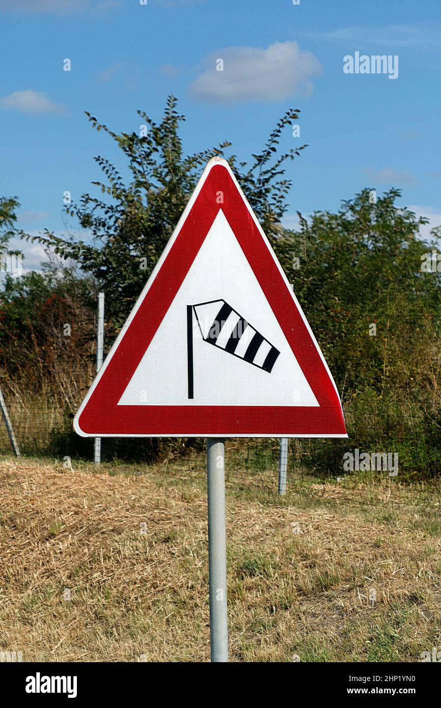 Warning traffic sign for strong wind inside white triangle outside on ...