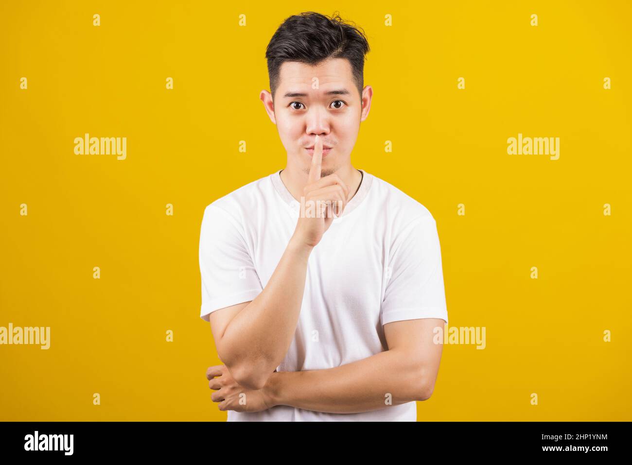 Finger over mouth shh hi-res stock photography and images - Alamy