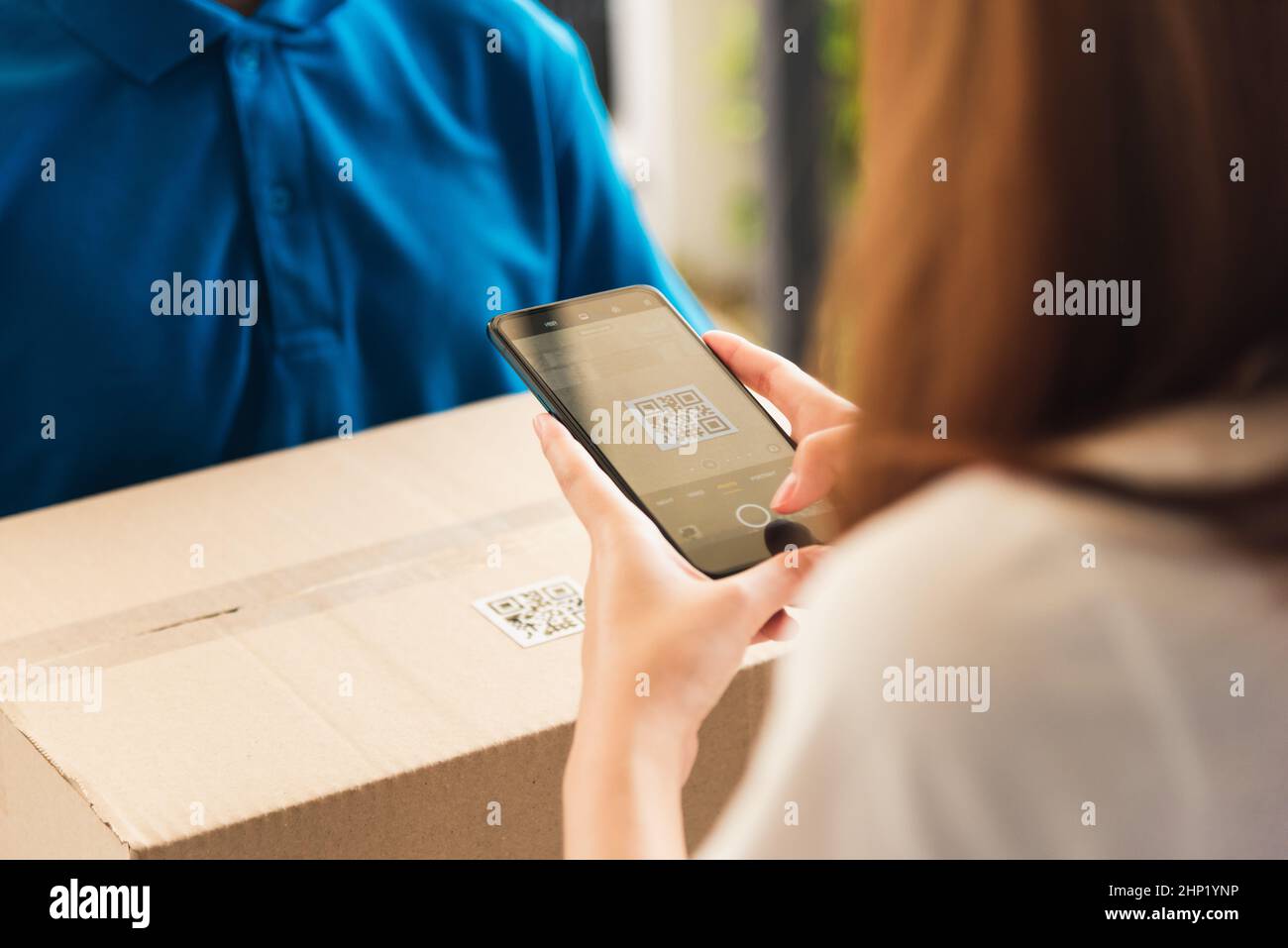 Asian customer young woman using mobile smartphone with QR code payment ...