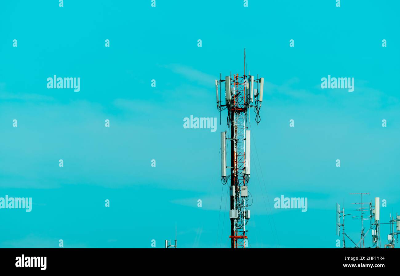 Telecommunication tower with blue sky background. Radio and satellite ...