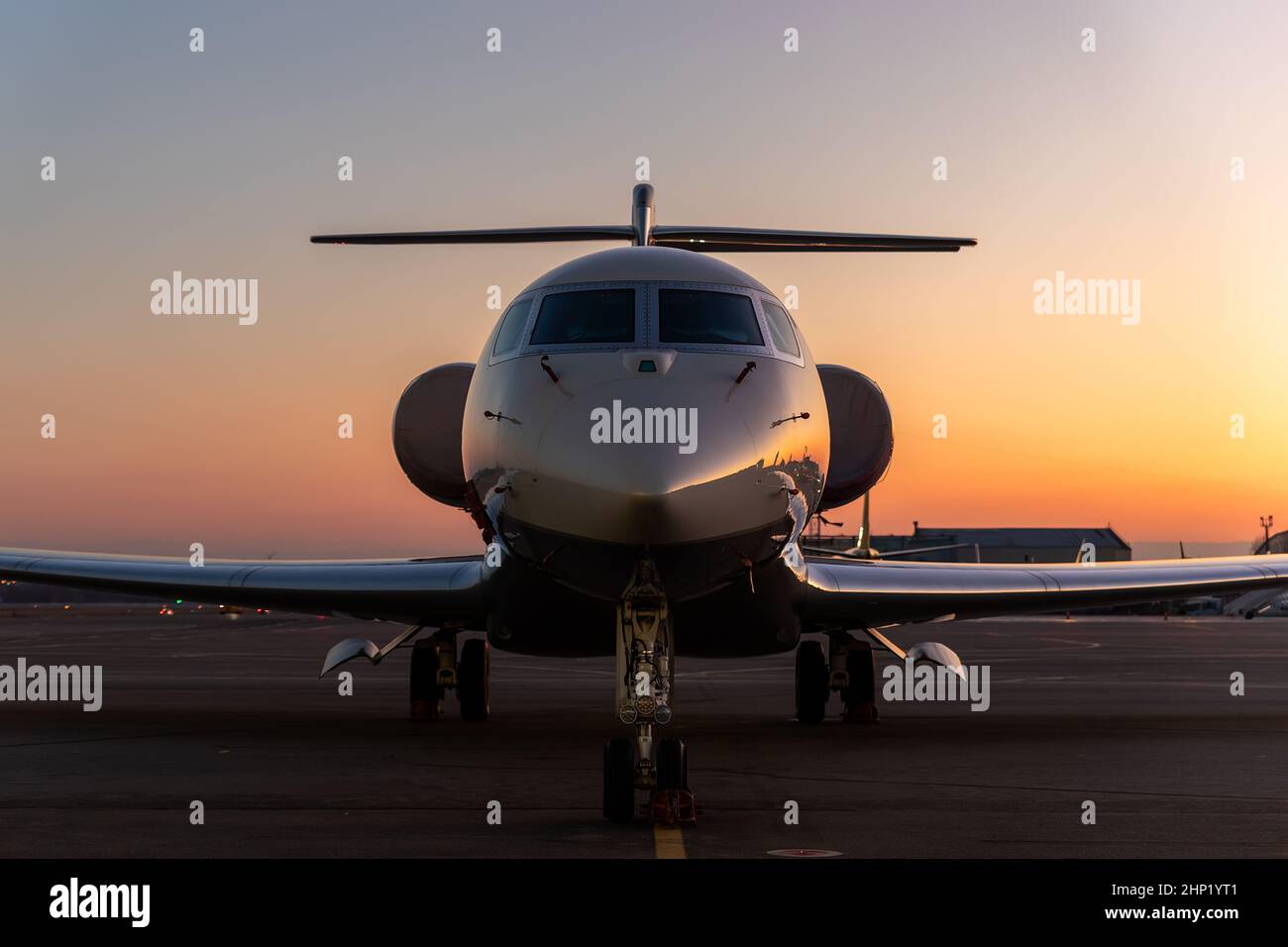 Scenic front view modern luxury expensive private jet plane parked ...