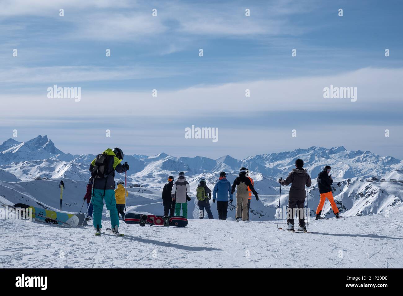 Skiers admiring the view from the top of Mt Vallon, Méribel Stock Photo ...
