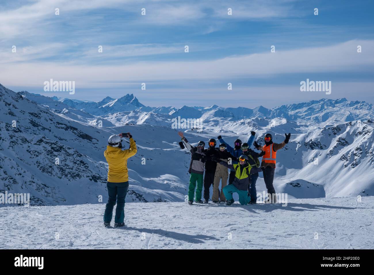 Skiers admiring the view from the top of Mt Vallon, Méribel Stock Photo ...
