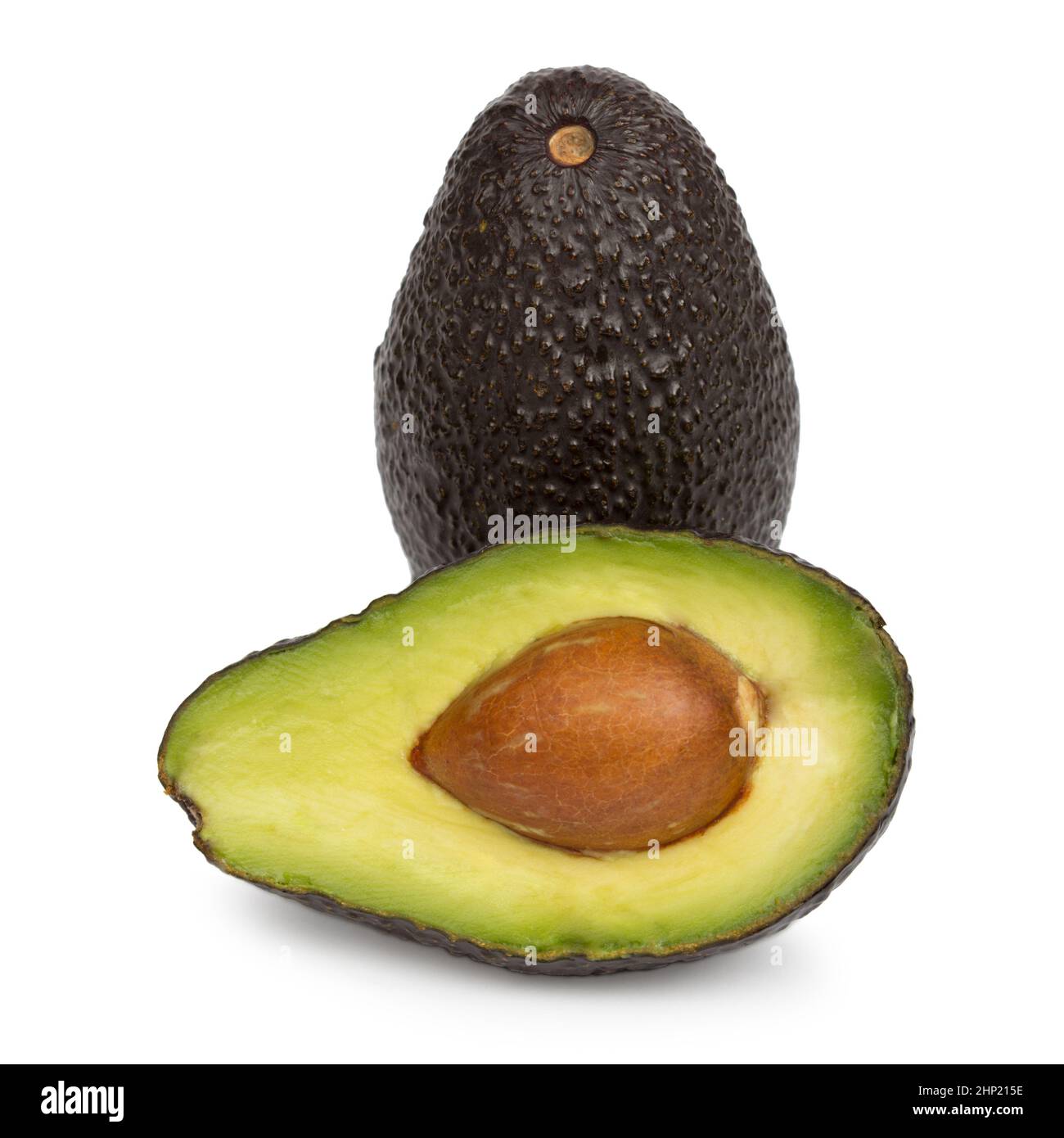 Whole avocado and half of avocado isolated on white Stock Photo - Alamy