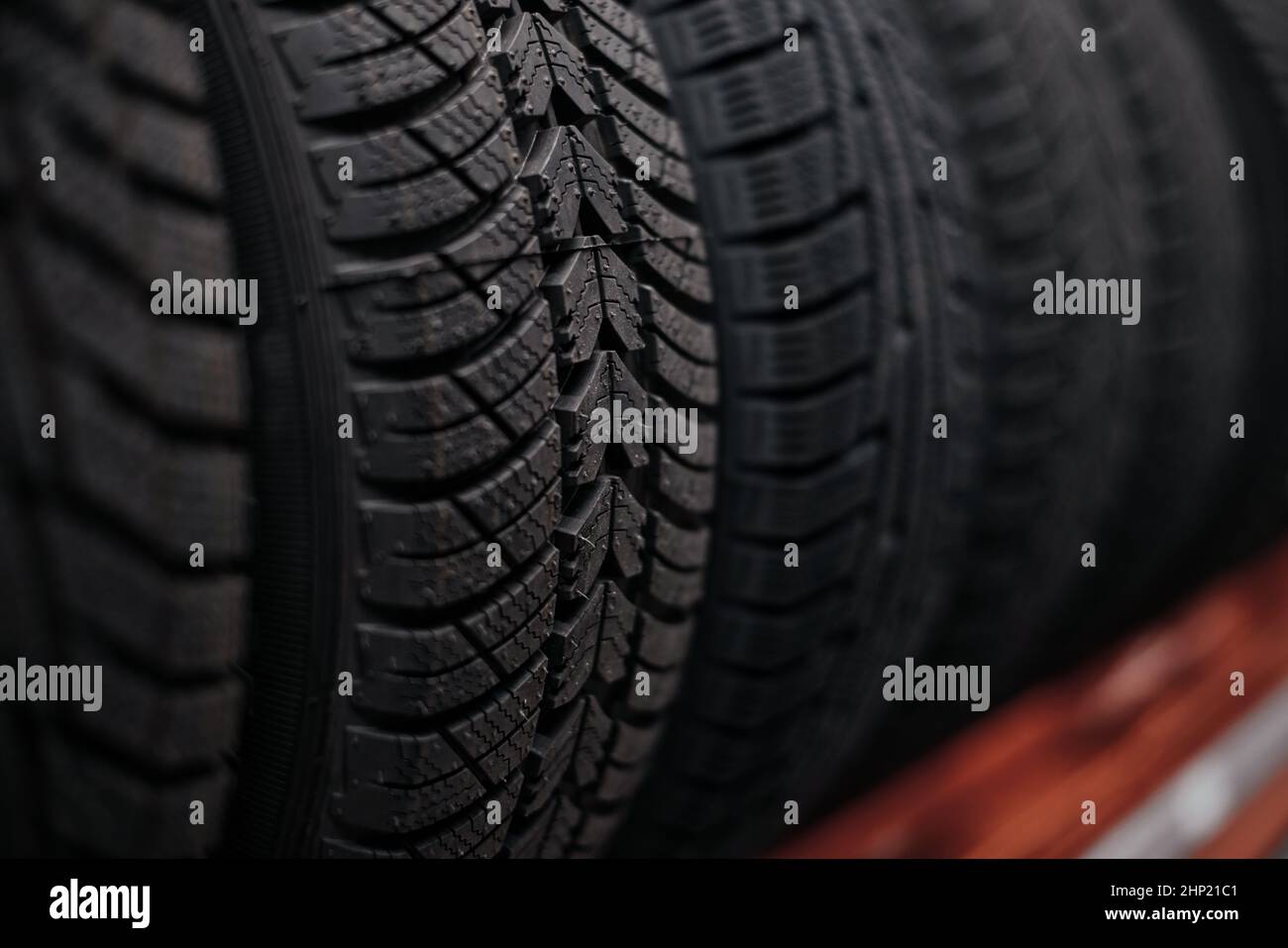 a lot of car tires on a rack in a car store, cose-up Stock Photo - Alamy