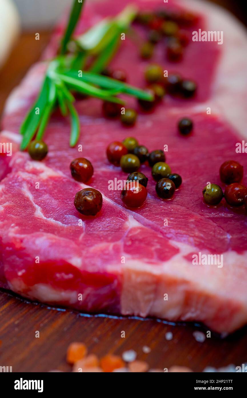 raw uncooked ribeye beef steak butcher selection Stock Photo - Alamy