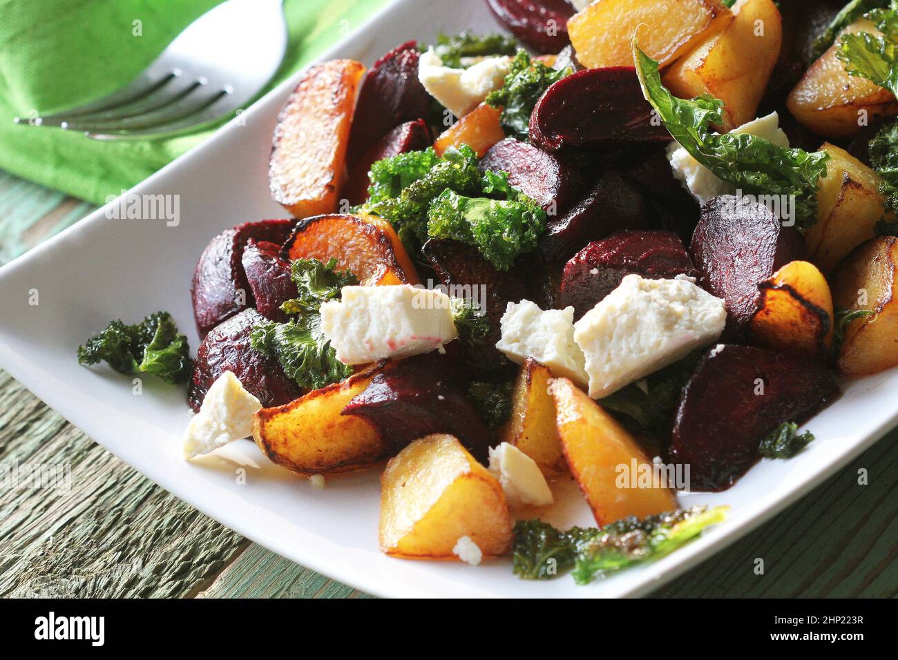 Roasted beet salad with feta cheese and fried cabbage kale Stock Photo ...