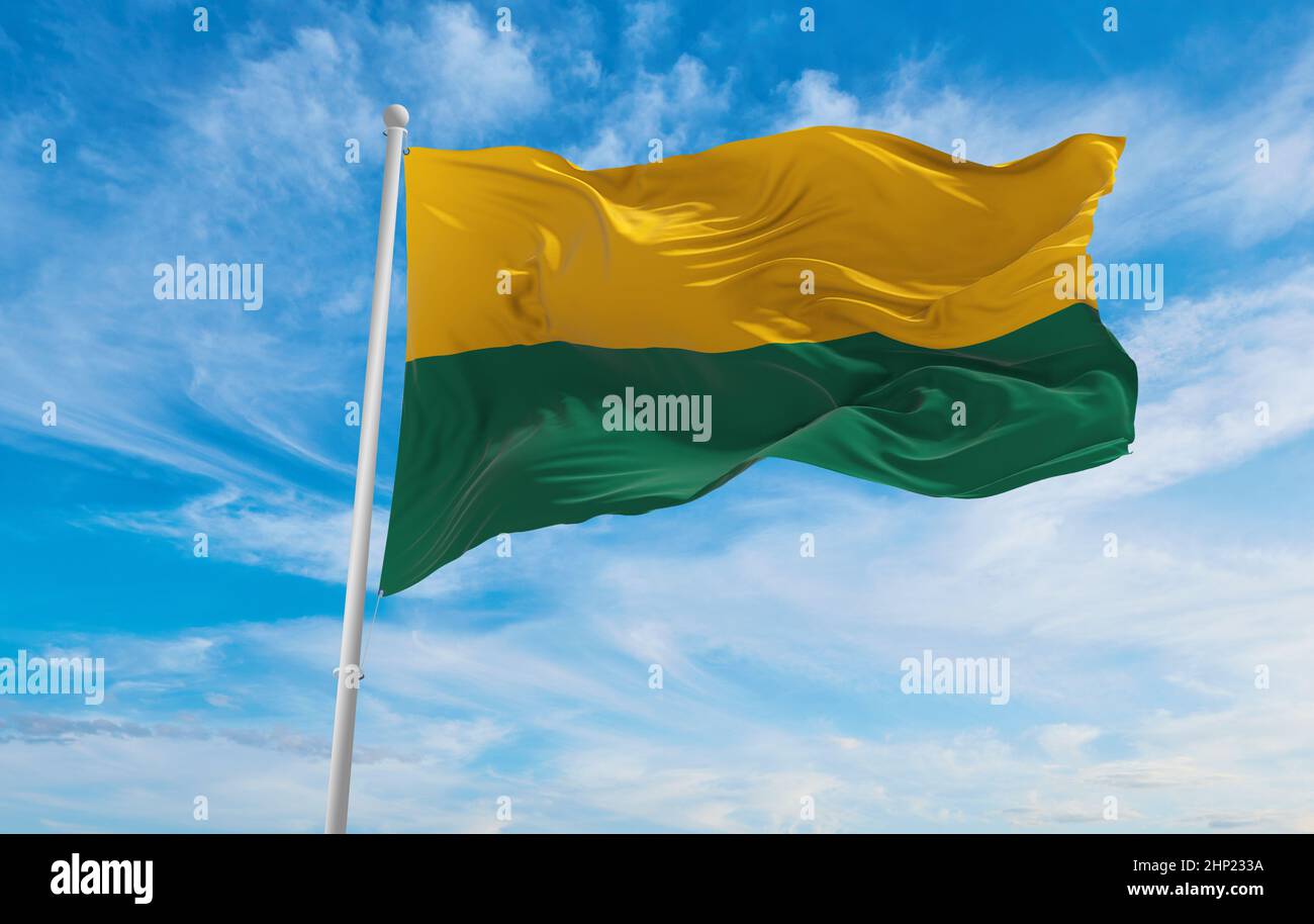 flag of The Hague , Netherlands at cloudy sky background on sunset ...