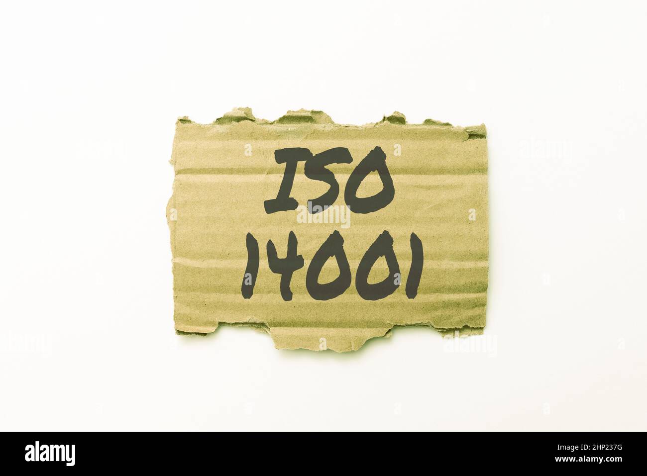 Hand writing sign Iso 14001, Word Written on a family of standards ...