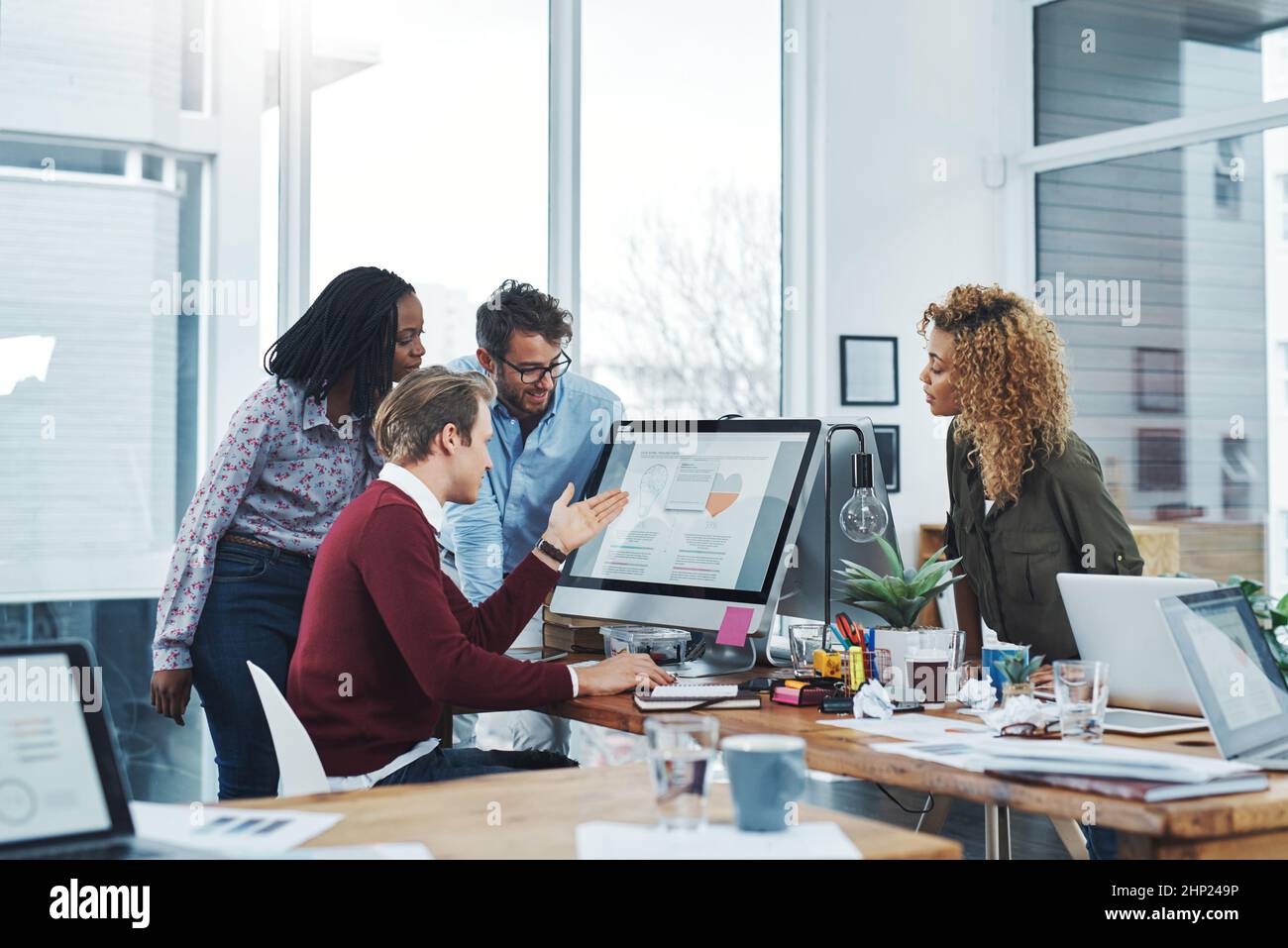 Nothing boosts productivity like teamwork. Shot of a group of ...
