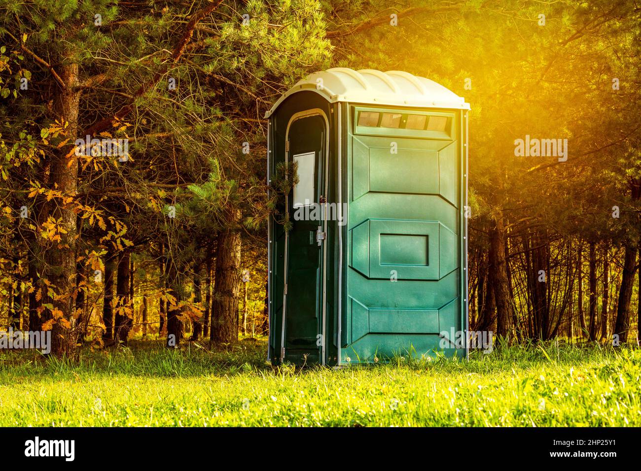Green portable toilet in the public park Stock Photo - Alamy