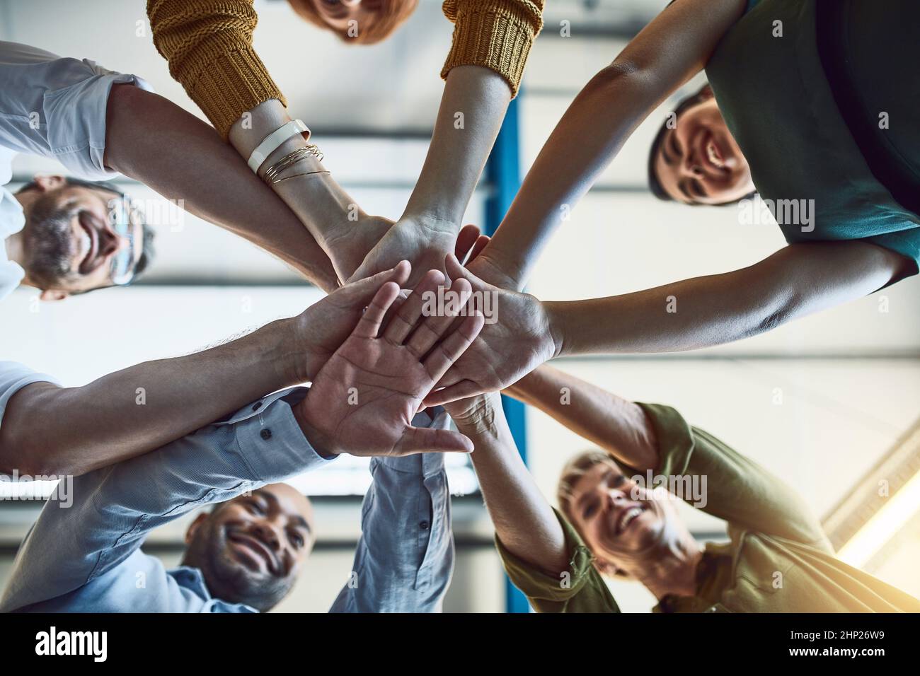 The supportive team is a strong team. Low angle shot of a group of ...