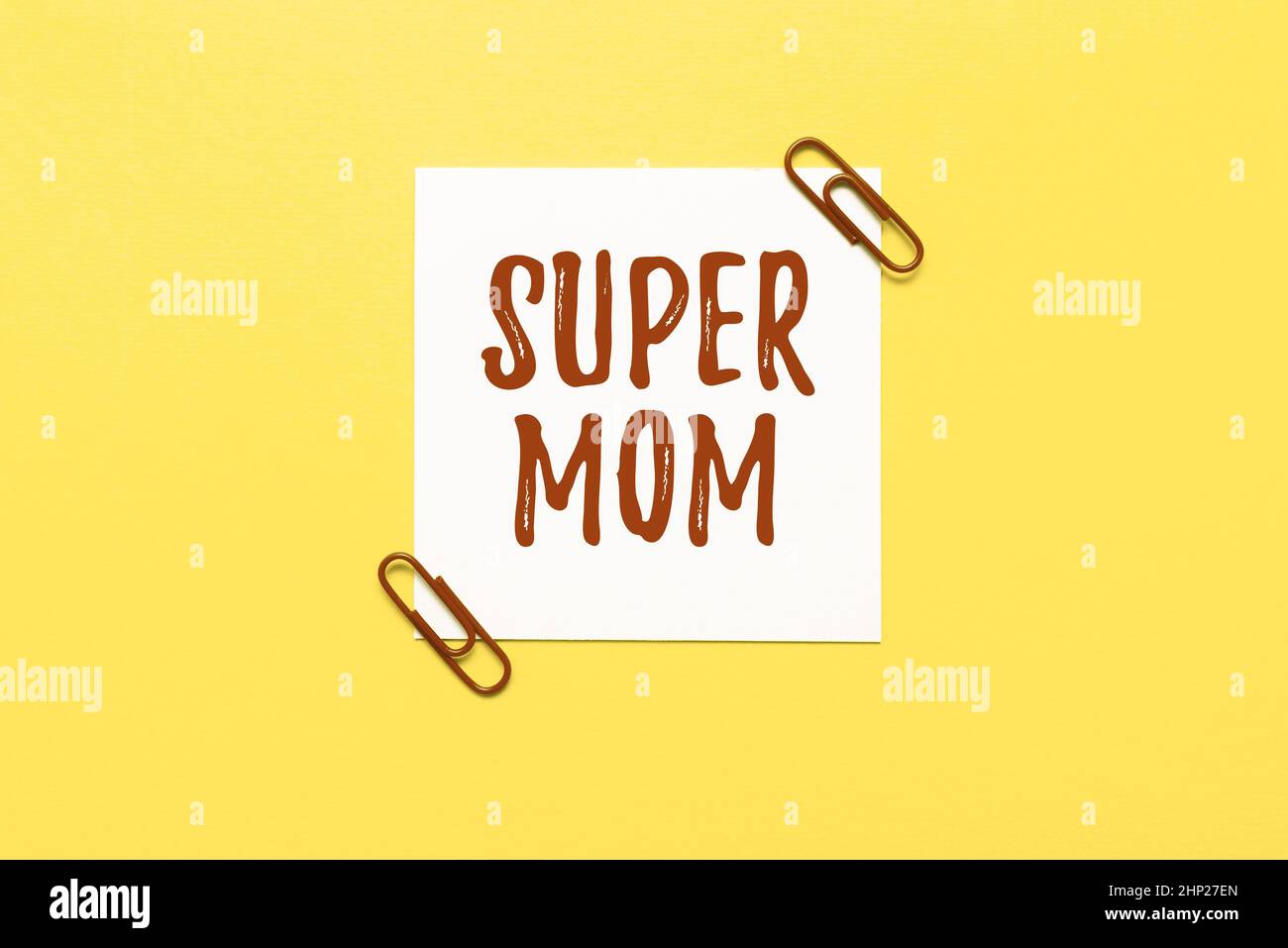 Hand writing sign Super Mom, Business concept a mother who can combine ...