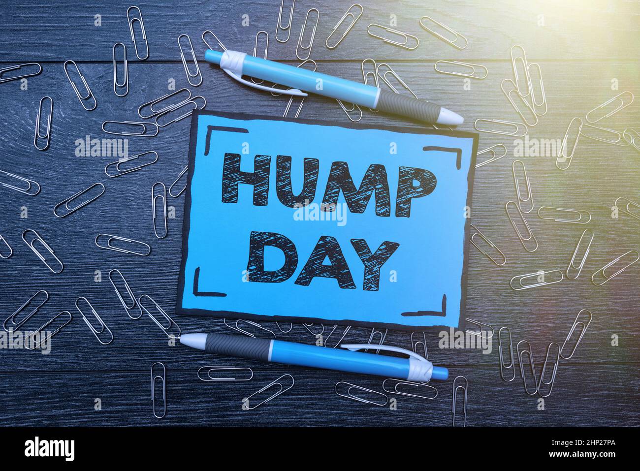 Text caption presenting Hump Day, Conceptual photo climbing a ...