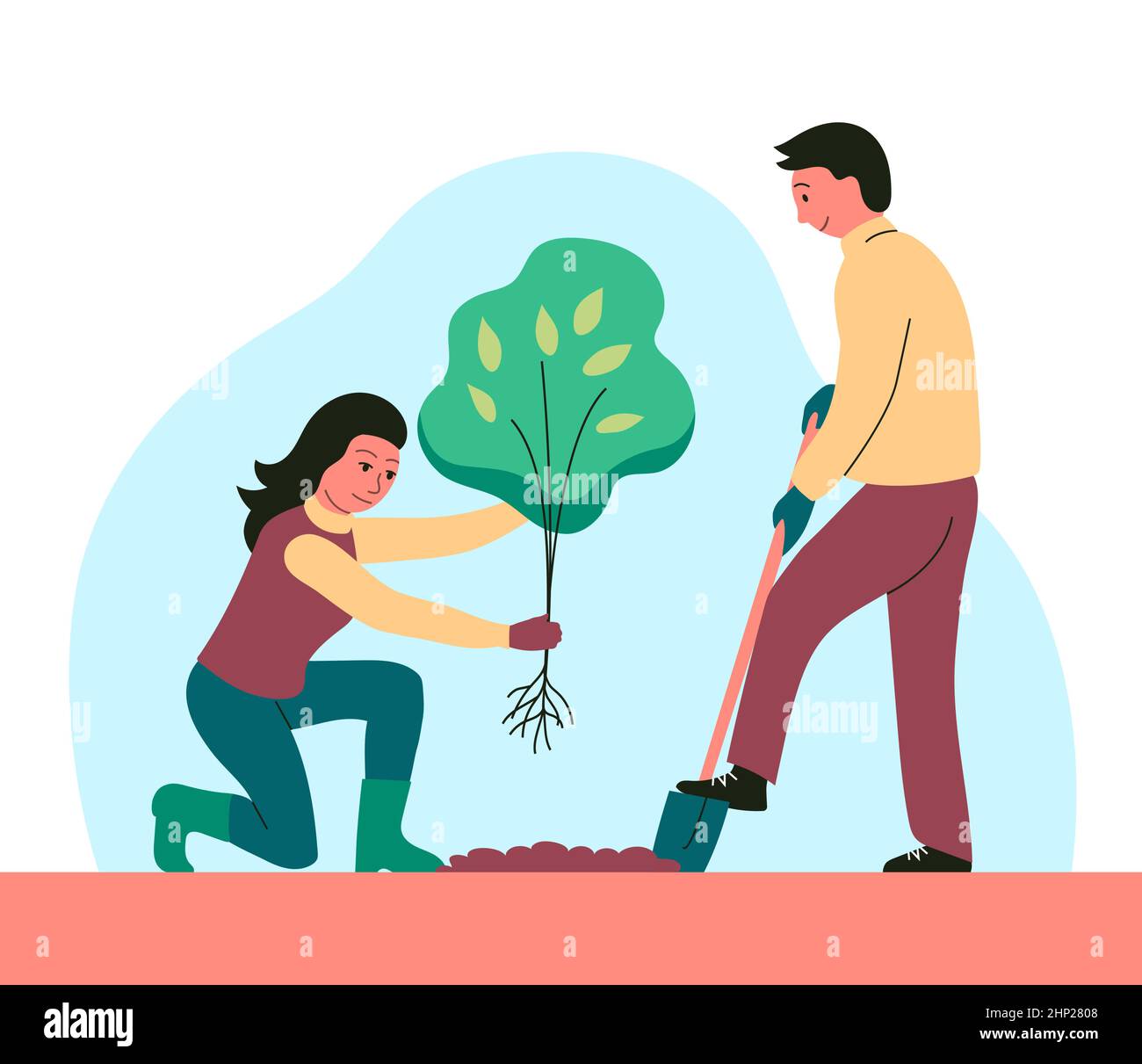 A family couple is planting a tree sapling. The man is digging with a ...