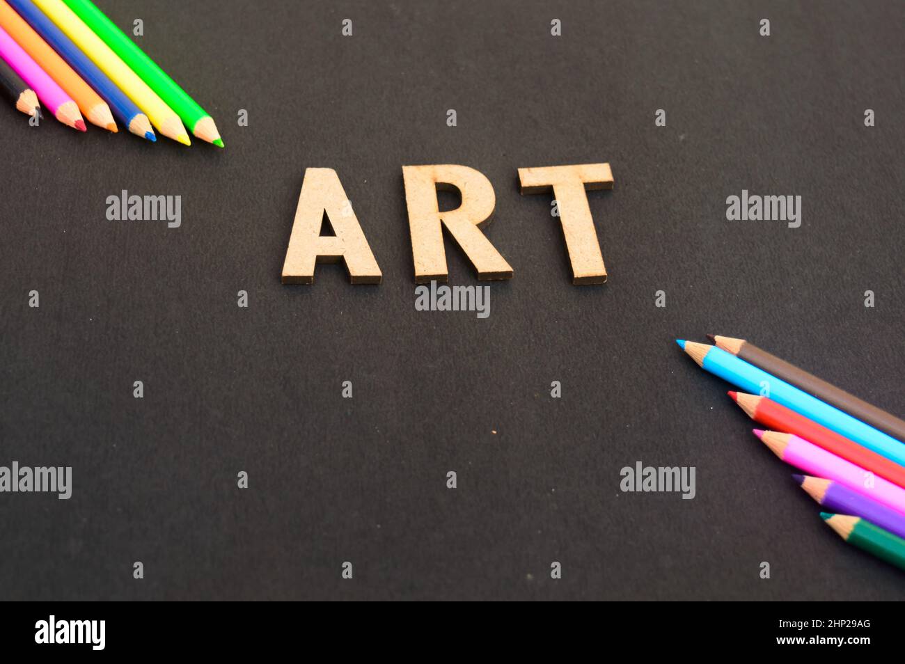 Art design background with color pencils and typography lettering ...