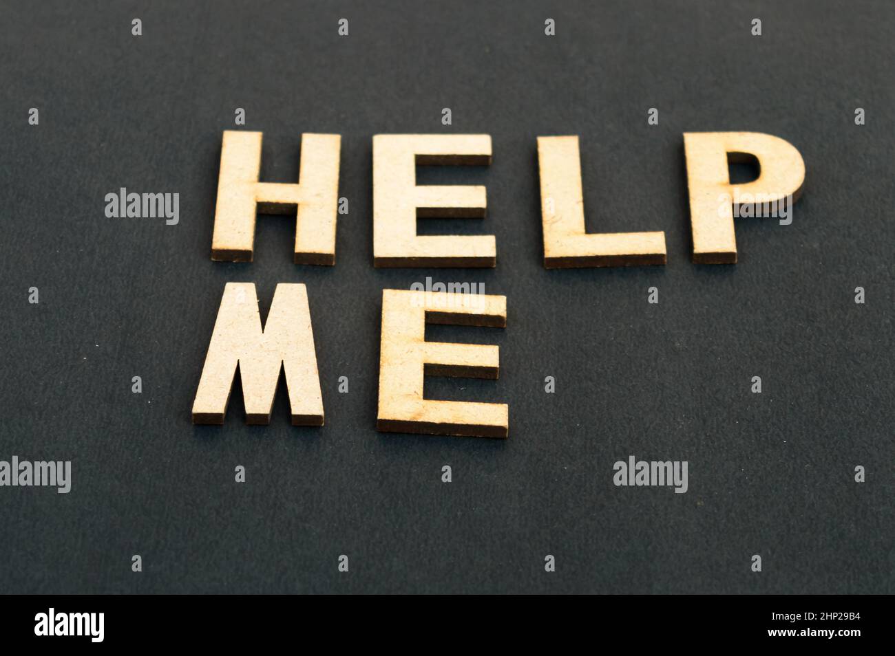 Help me symbol. Wooden cubes words help me isolated on black background ...