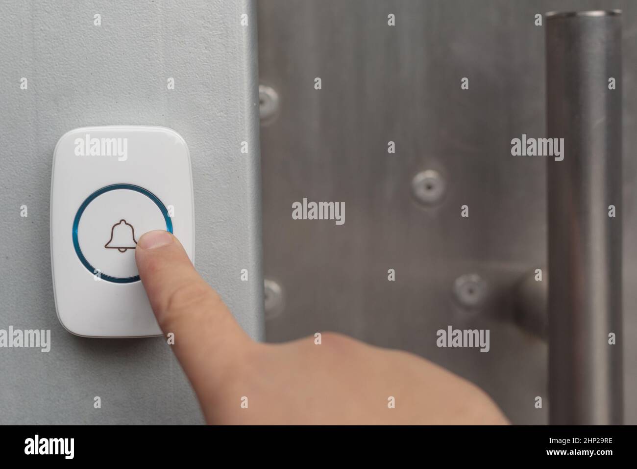 Hand pressing button on outdoor doorbell with an intercom Stock Photo ...