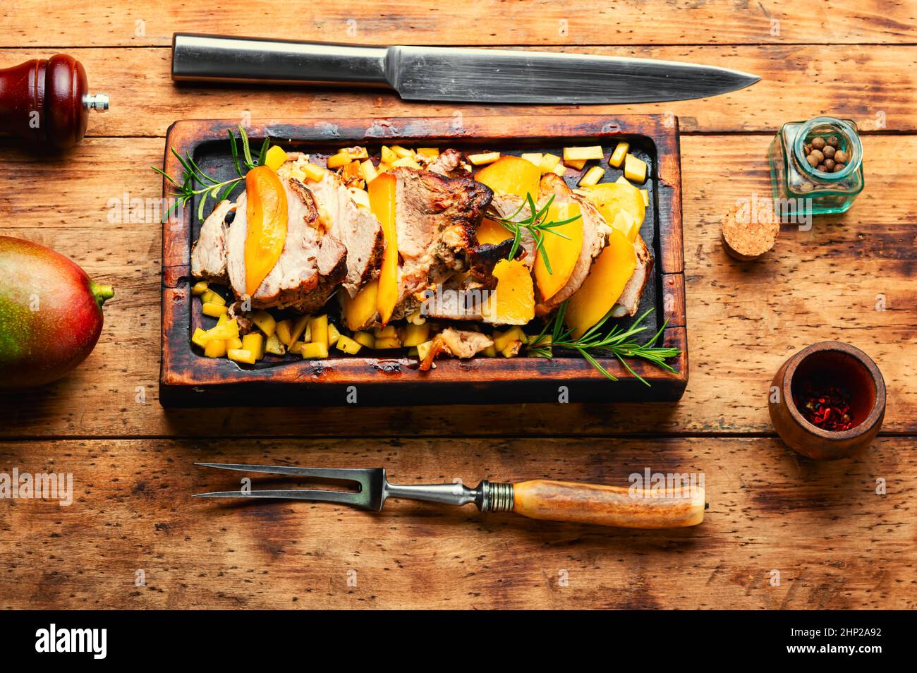Delicious grilled meat with mango and cheese Stock Photo - Alamy