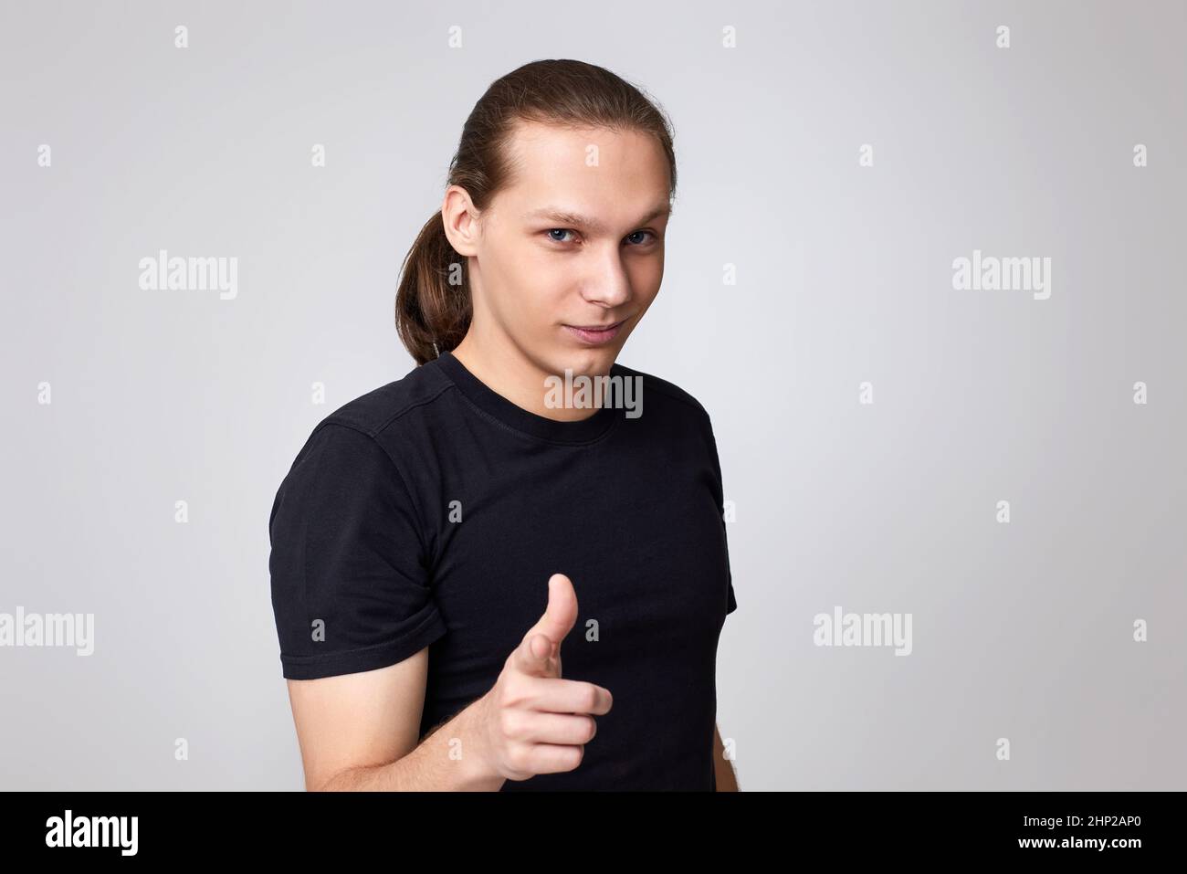 young handsome man black in t-tshirt showing Ok gesture isolated on ...