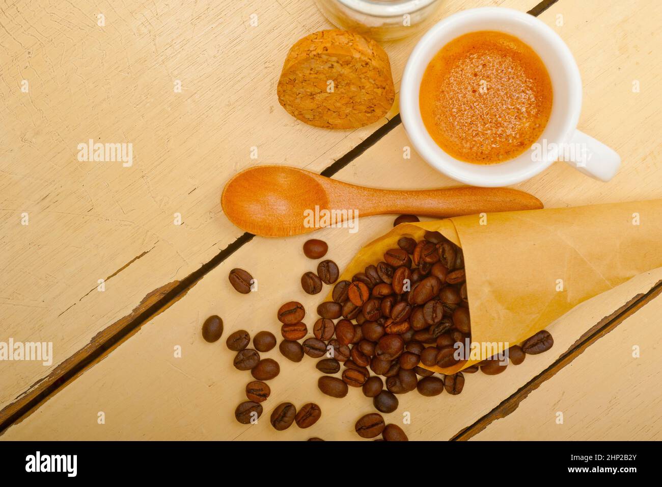 espresso coffee and beans on a paper cone cornucopia over white ...