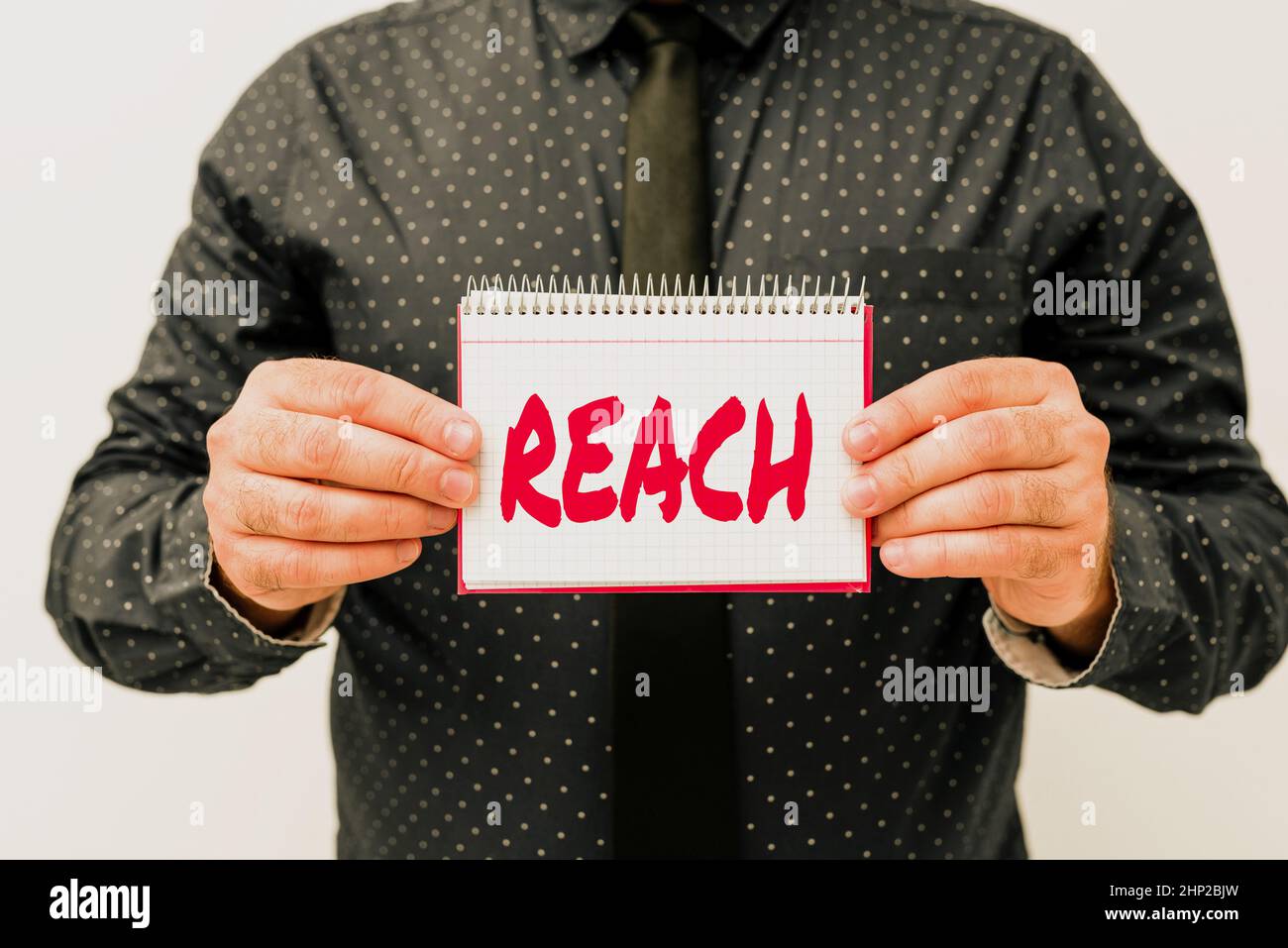 Text sign showing Reach, Word Written on the distance within which something can be touched or ...