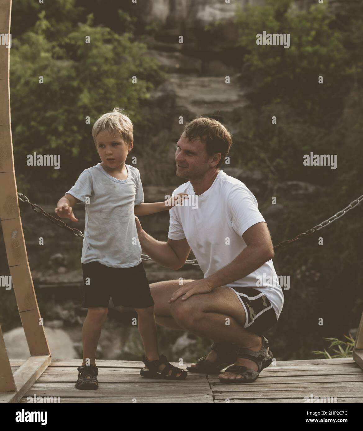 Vintage matte effect photo. Happy lifestyle moment. Man crouched ...