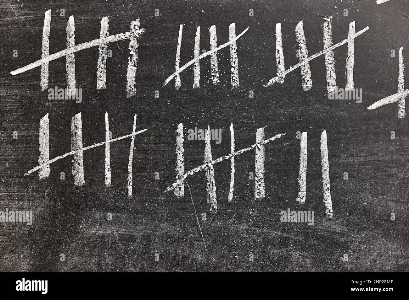 Drawing counting tally chart with chalk, marks in groups of five, counting days Stock Photo - Alamy