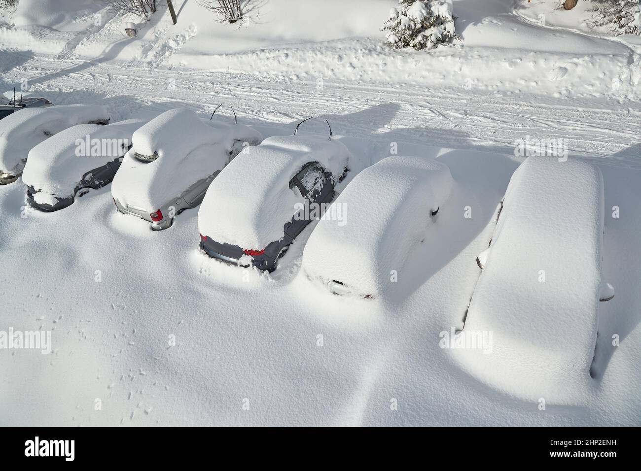 Parking cars covered with fresh snow in winter Stock Photo - Alamy