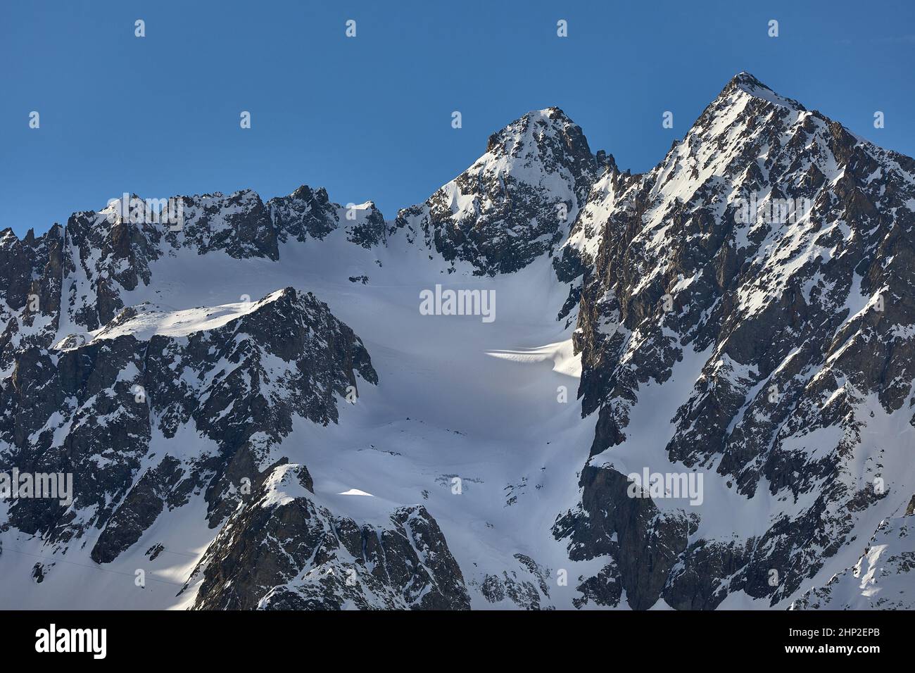 High mountain range in winter, rocky peaks Stock Photo - Alamy