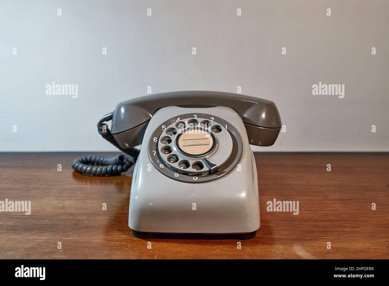 Vintage telephone on a table Stock Photo - Alamy