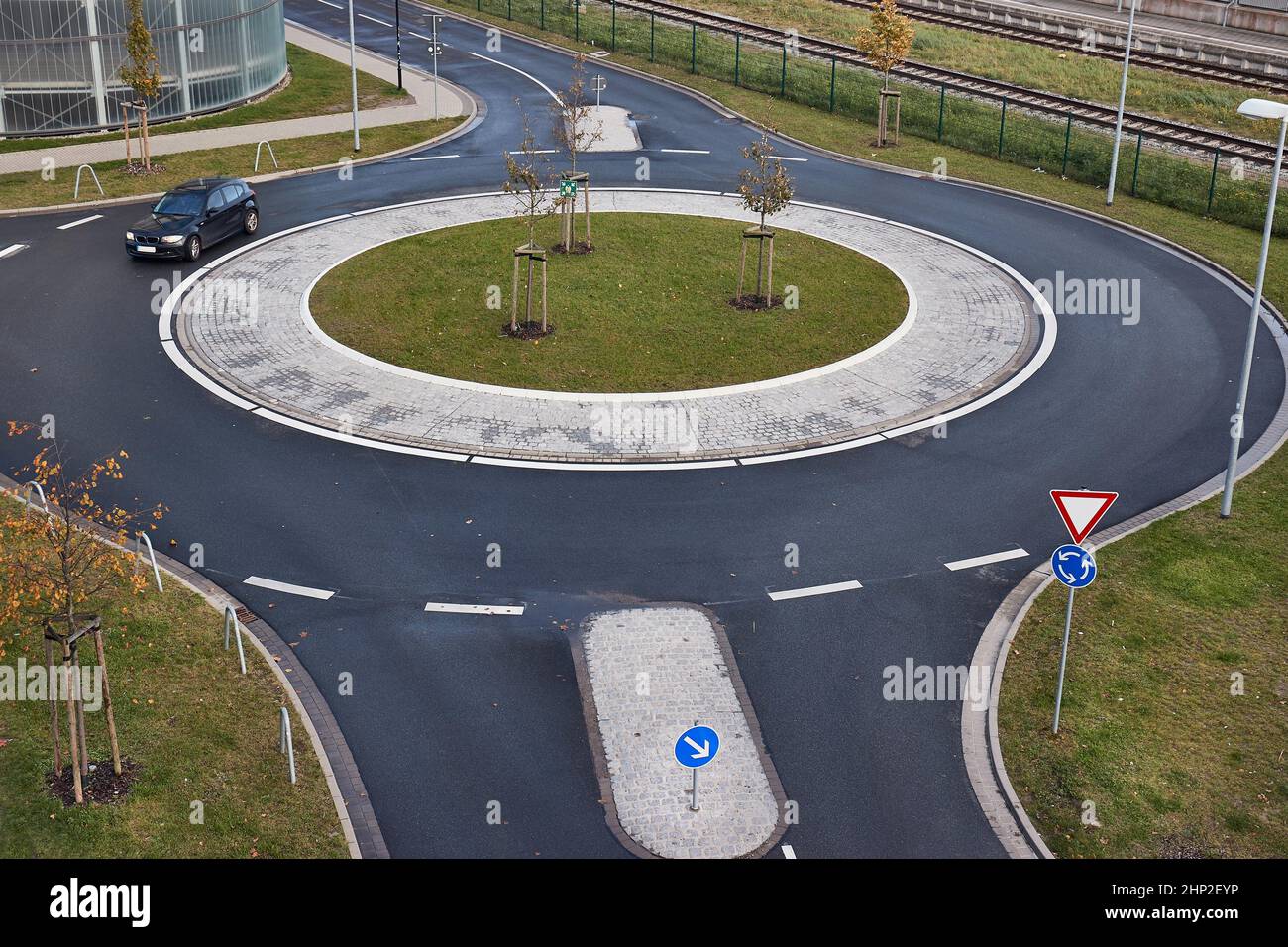 Roundabout on suburban road viewed from above Stock Photo - Alamy