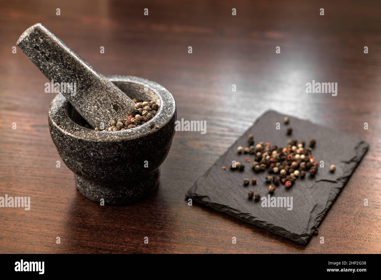 peppercorns of black and color pepper with granite mortar Stock Photo ...