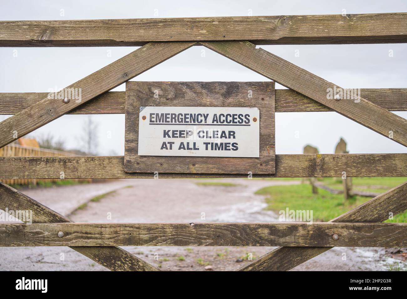 Outdoor sign on rural, UK countryside gate giving notice to public ...