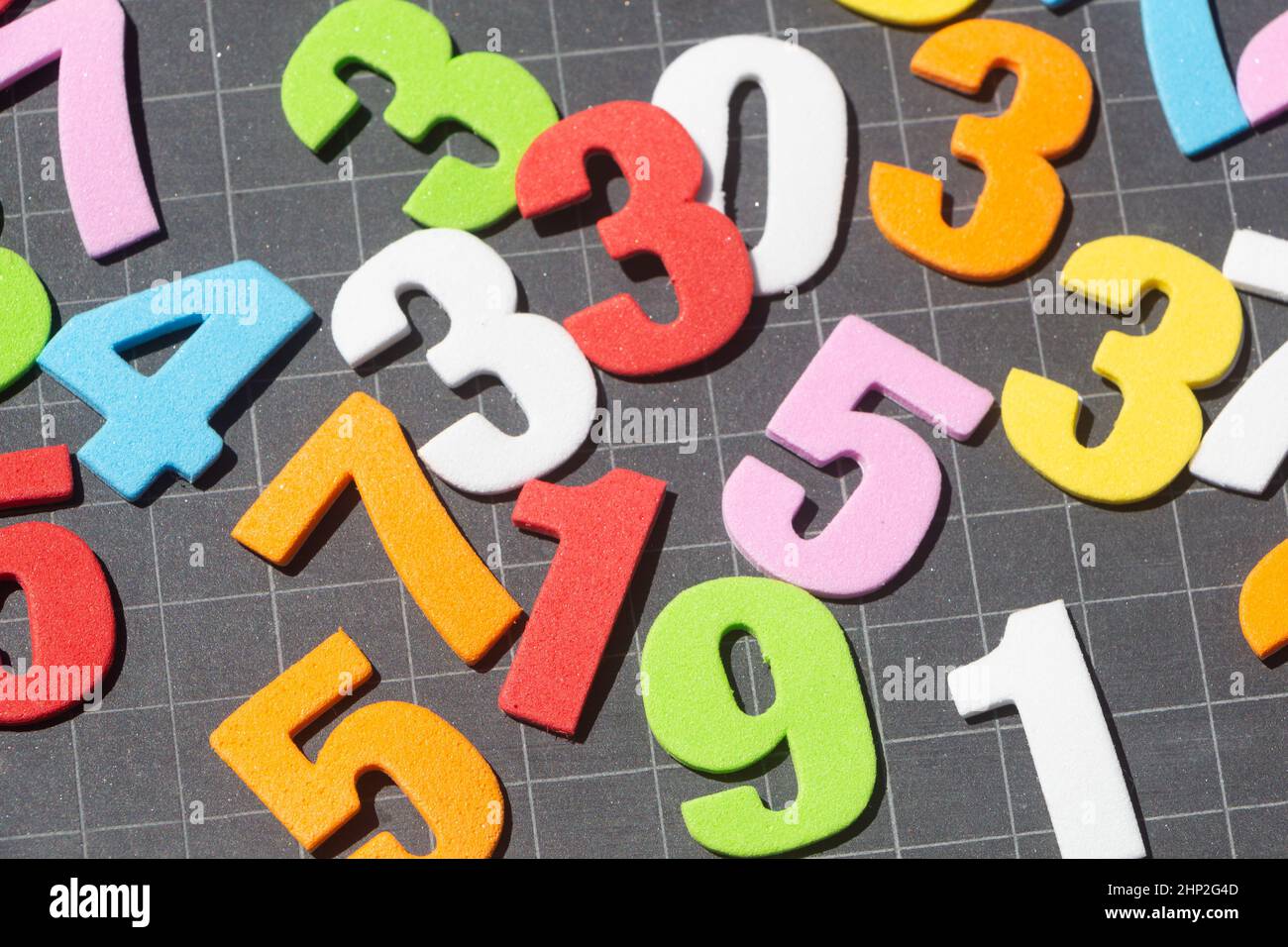 Chalkboard slate and colored figures to teach math Stock Photo - Alamy