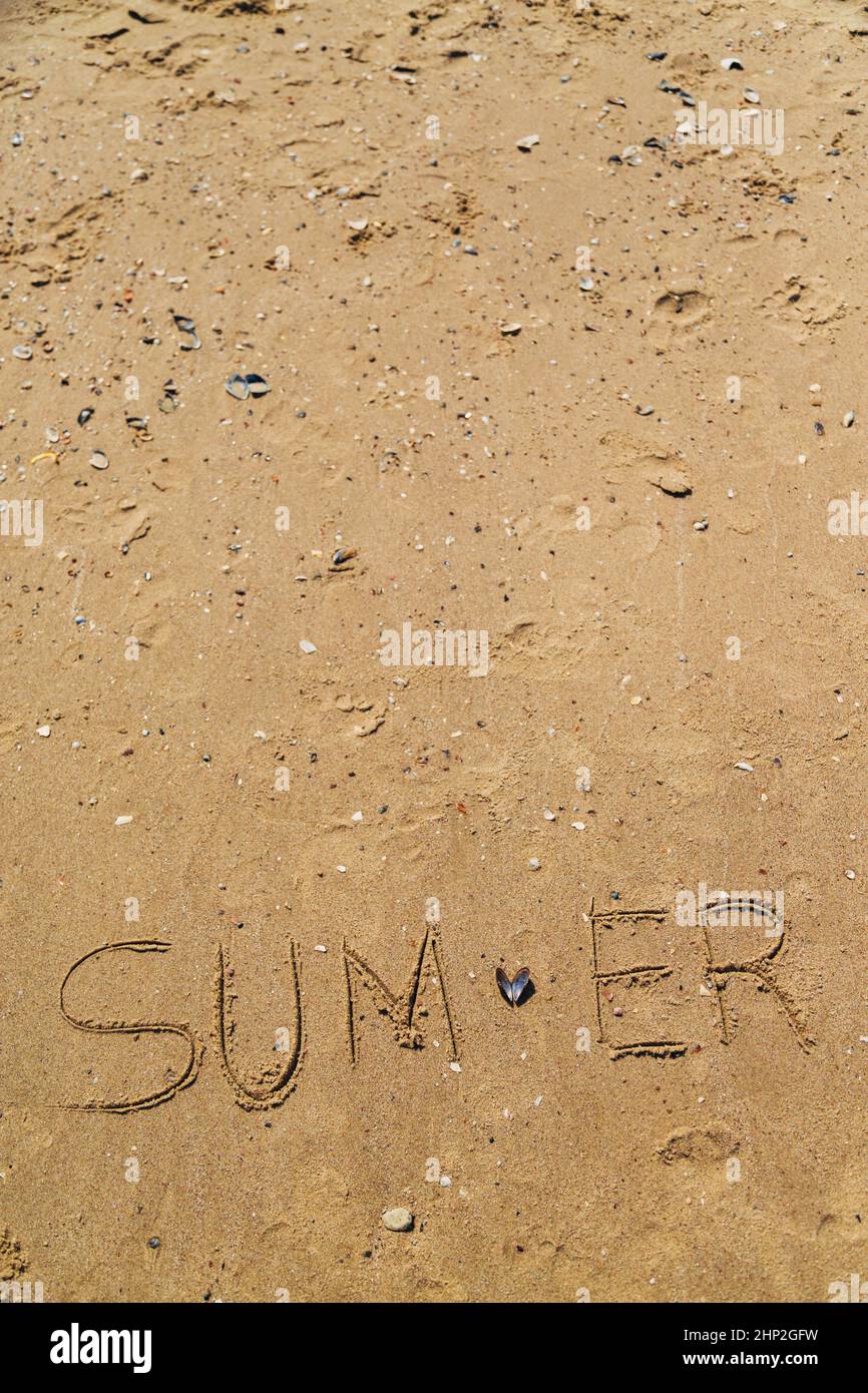 Word Summer Written on the Sand of a Beach. Text on the Golden Sea ...